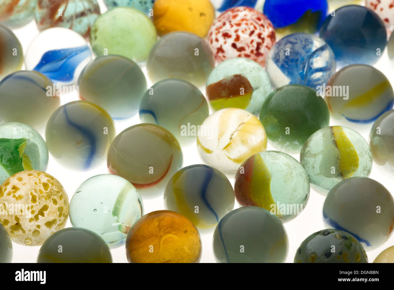 collection of old glass transparent marbles with unique swirls of ...