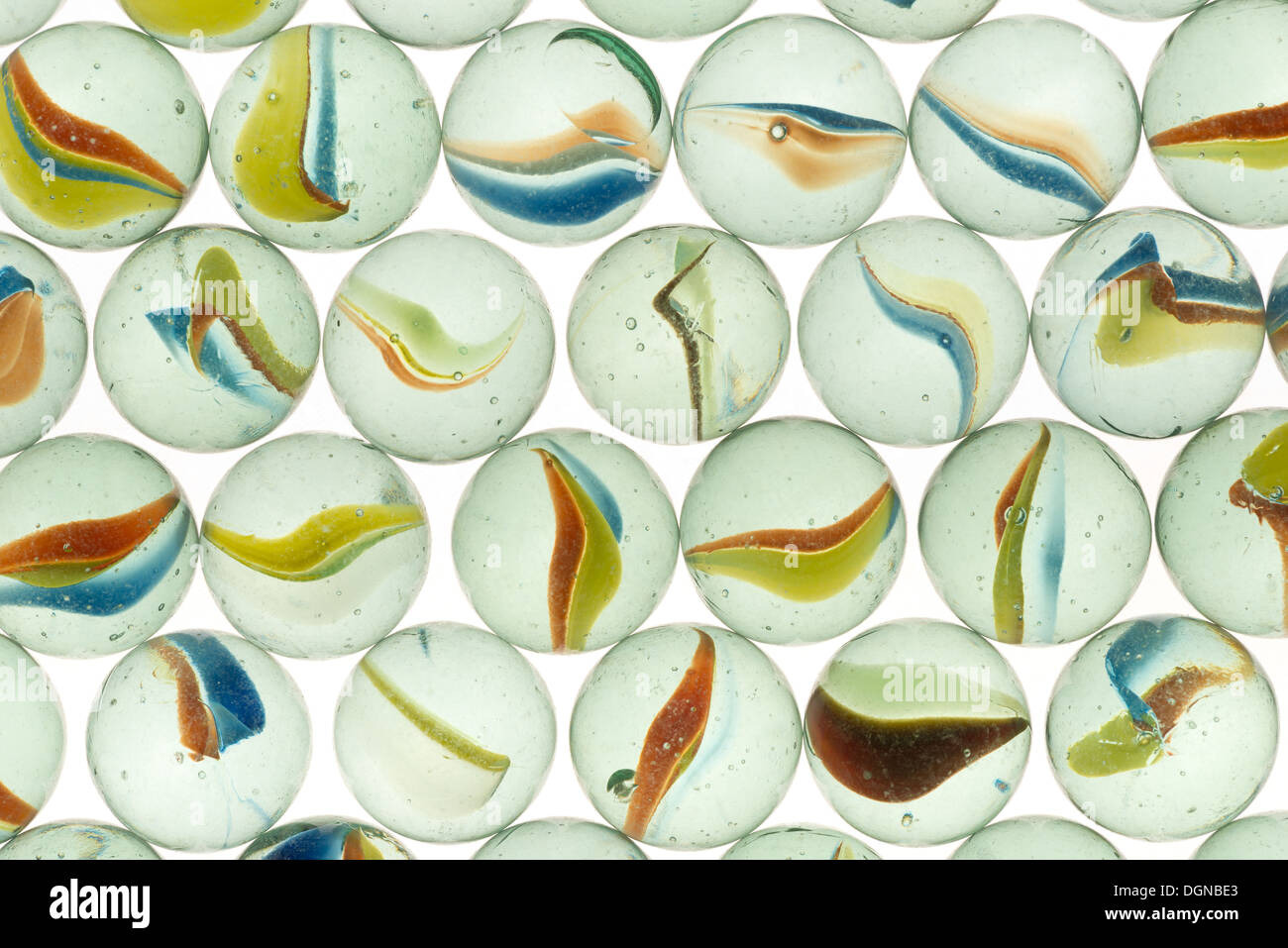 collection of old glass transparent marbles with unique swirls of ...