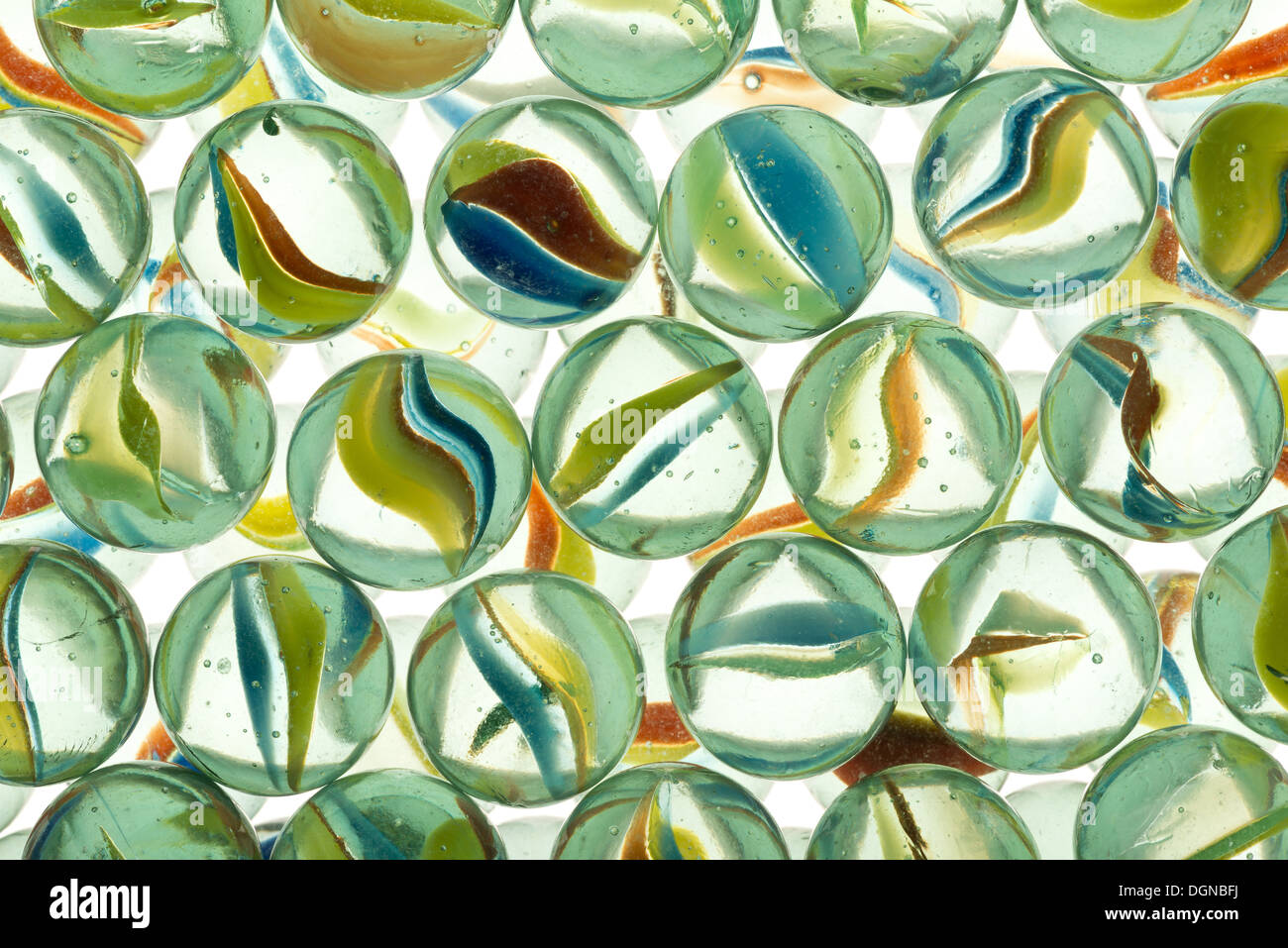 collection of old glass transparent marbles with unique swirls of ...