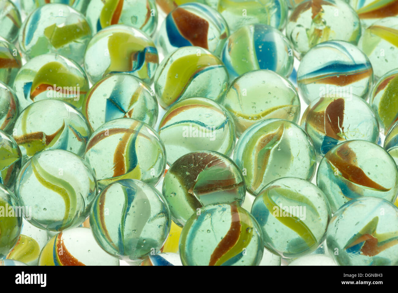 collection of old glass transparent marbles with unique swirls of ...