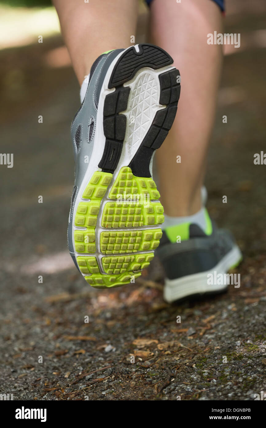 Woman running away from camera Stock Photo - Alamy