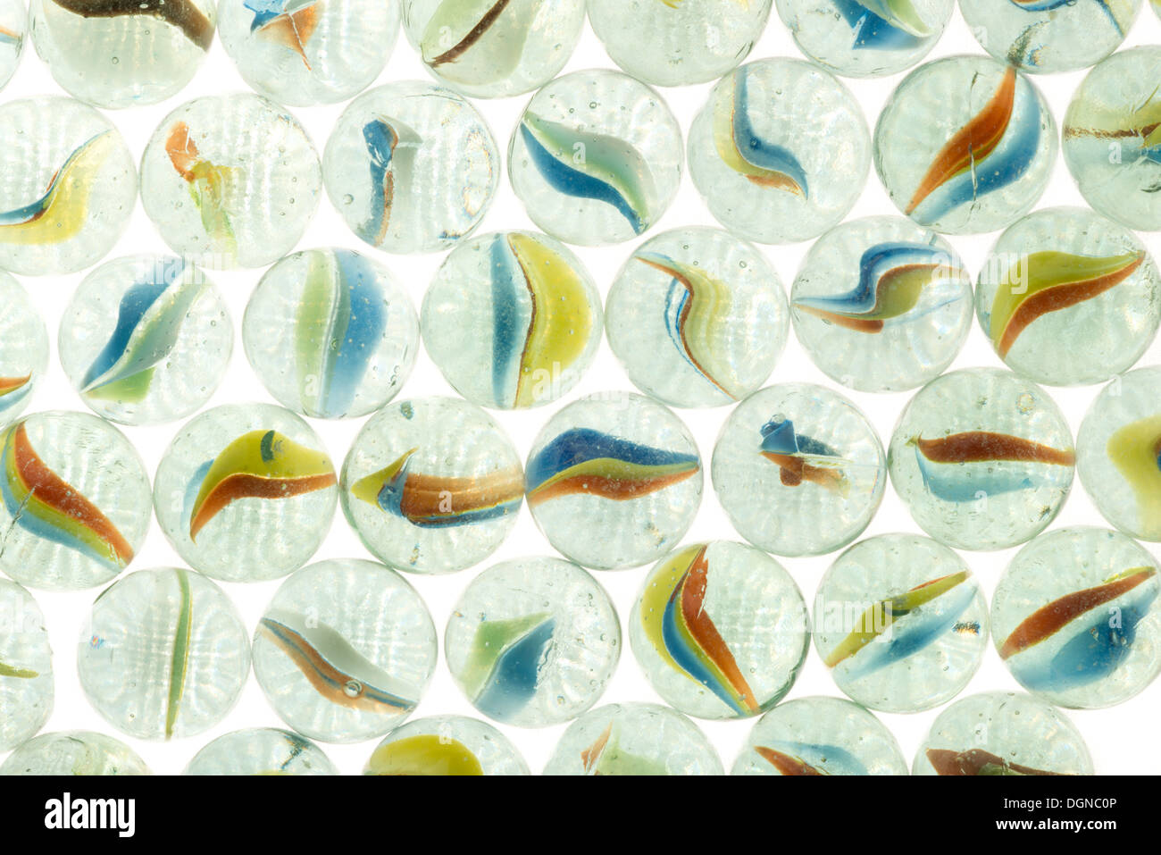 collection of old glass transparent marbles with unique swirls of ...