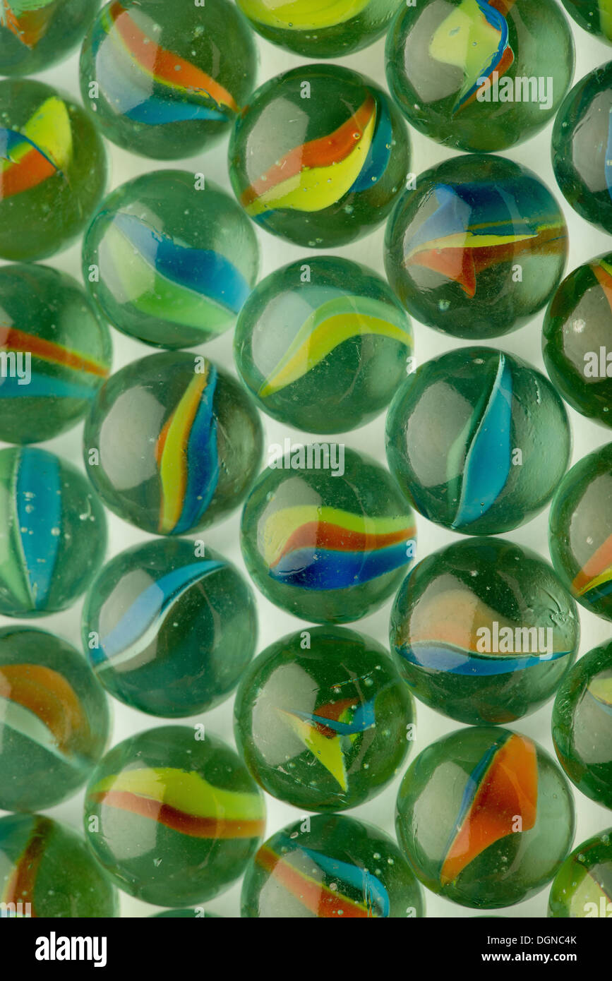 collection of old glass transparent marbles with unique swirls of ...