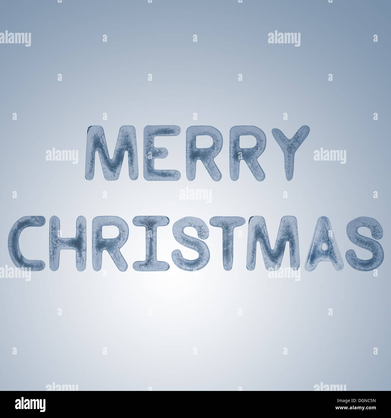 Merry Christmas message on ice letters Stock Photo - Alamy