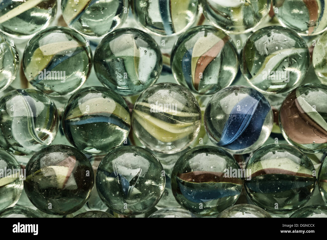 collection of old glass transparent marbles with unique swirls of ...