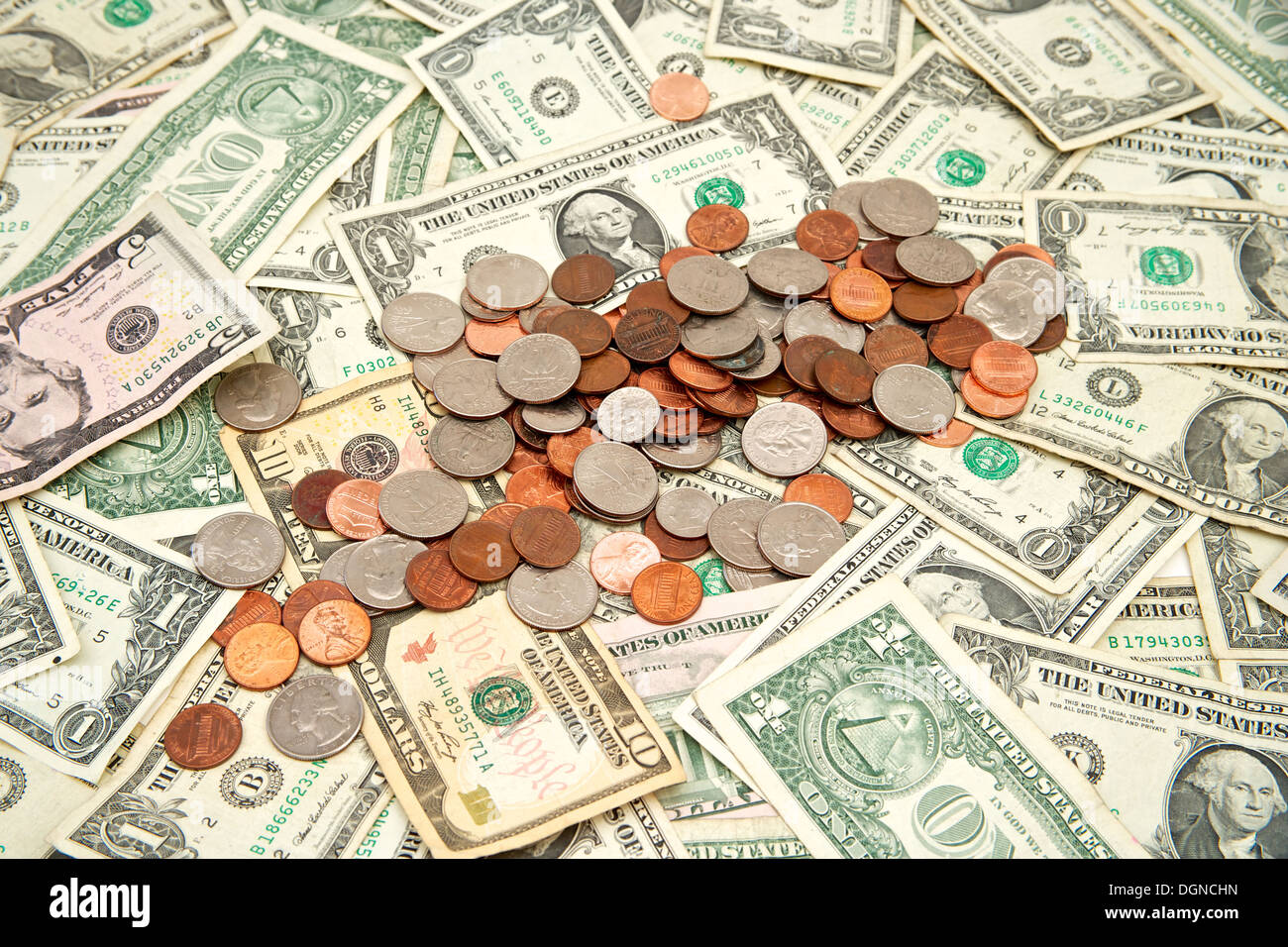 American coins piled on top of spread out money Stock Photo - Alamy