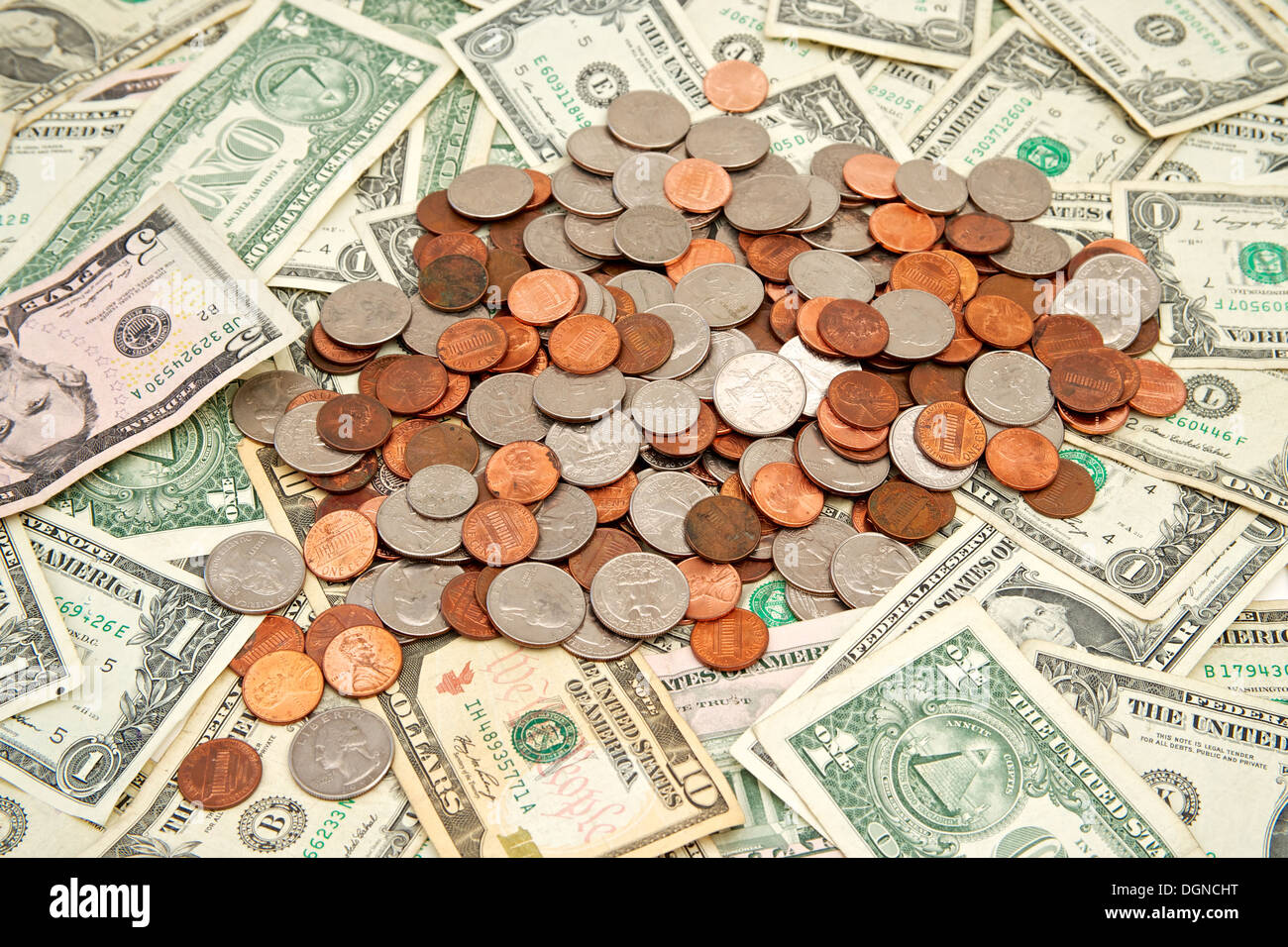 American coins piled on top of spread out money Stock Photo - Alamy