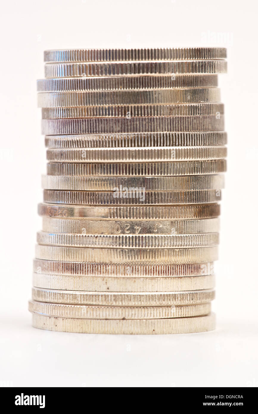 Stack of silver coins on white background Stock Photo - Alamy