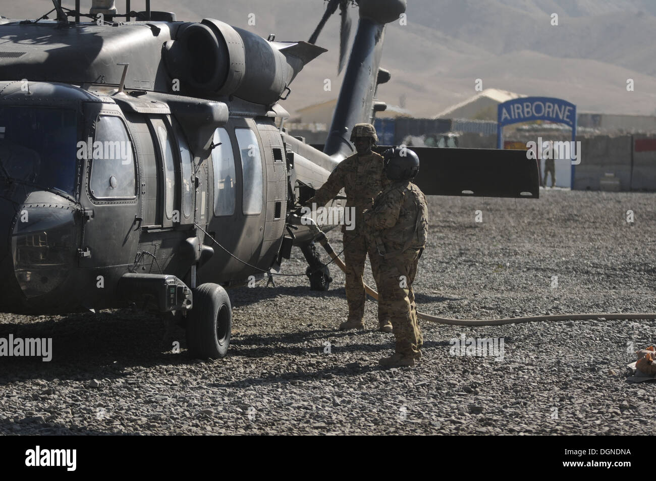 Sgt. Jason Leaders (right), a UH-60M Black Hawk helicopter crew chief ...