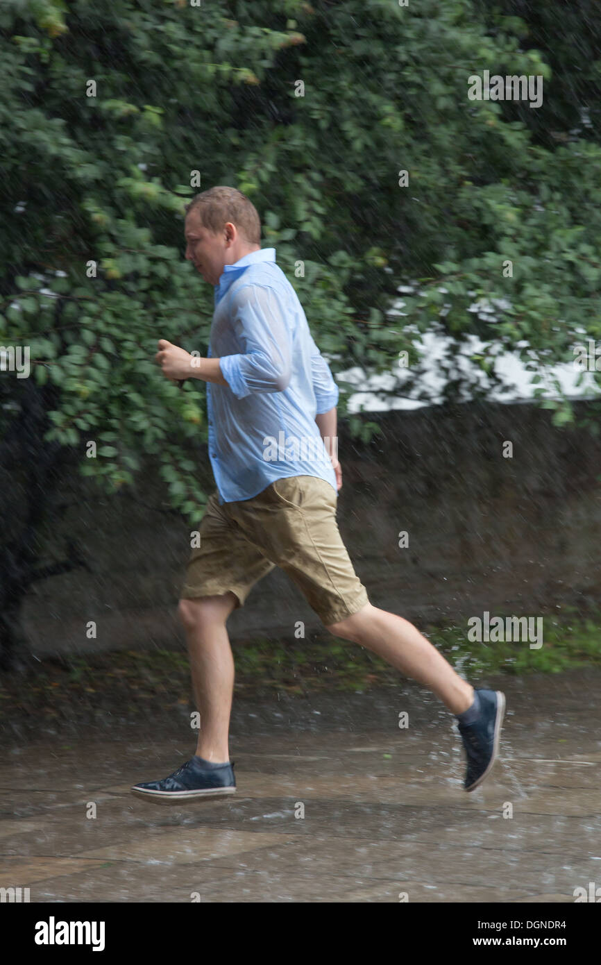 Warsaw, Poland, a drenched man walks through puddles Stock Photo - Alamy