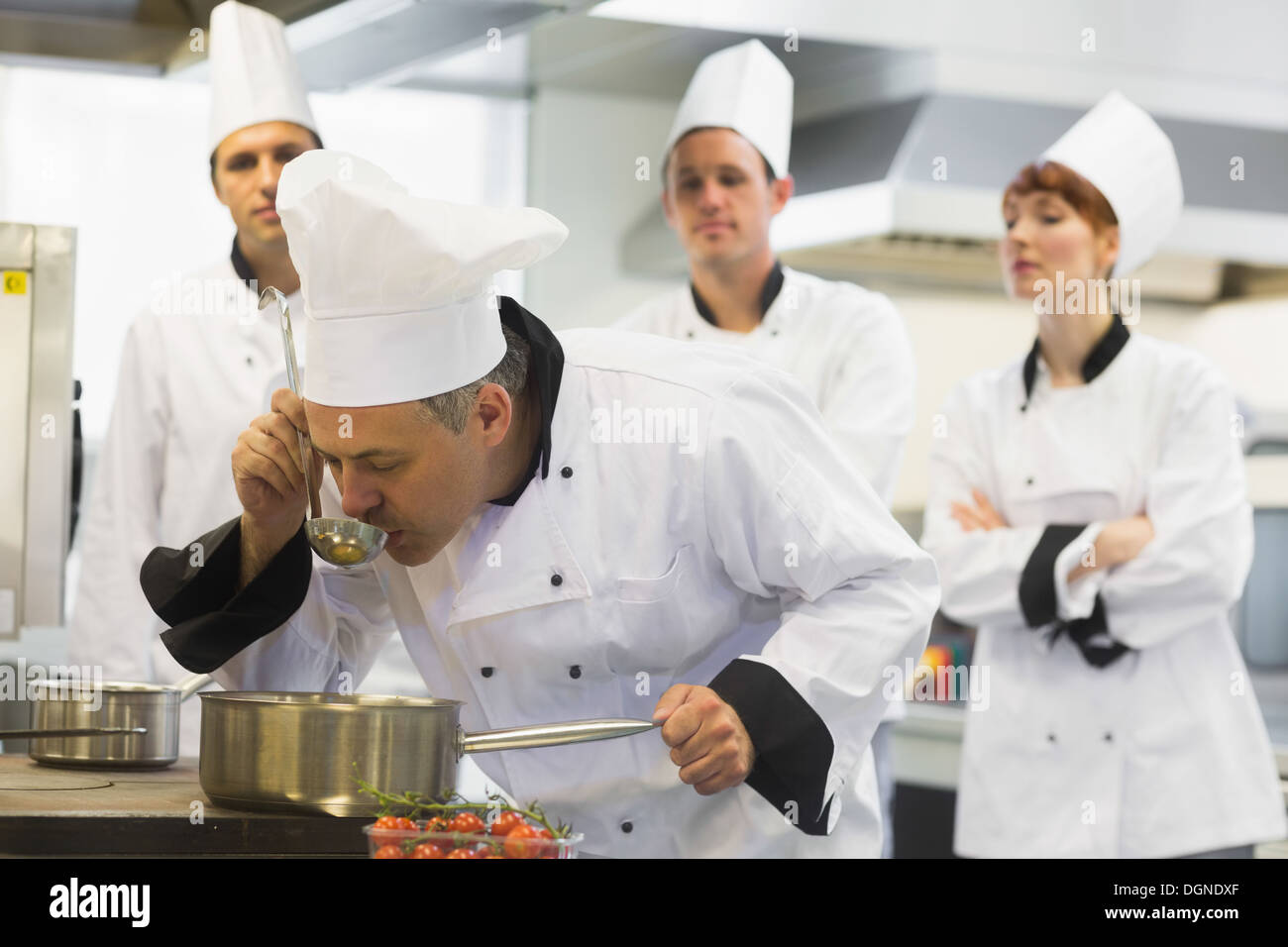 Head chef tasting a soup Stock Photo - Alamy