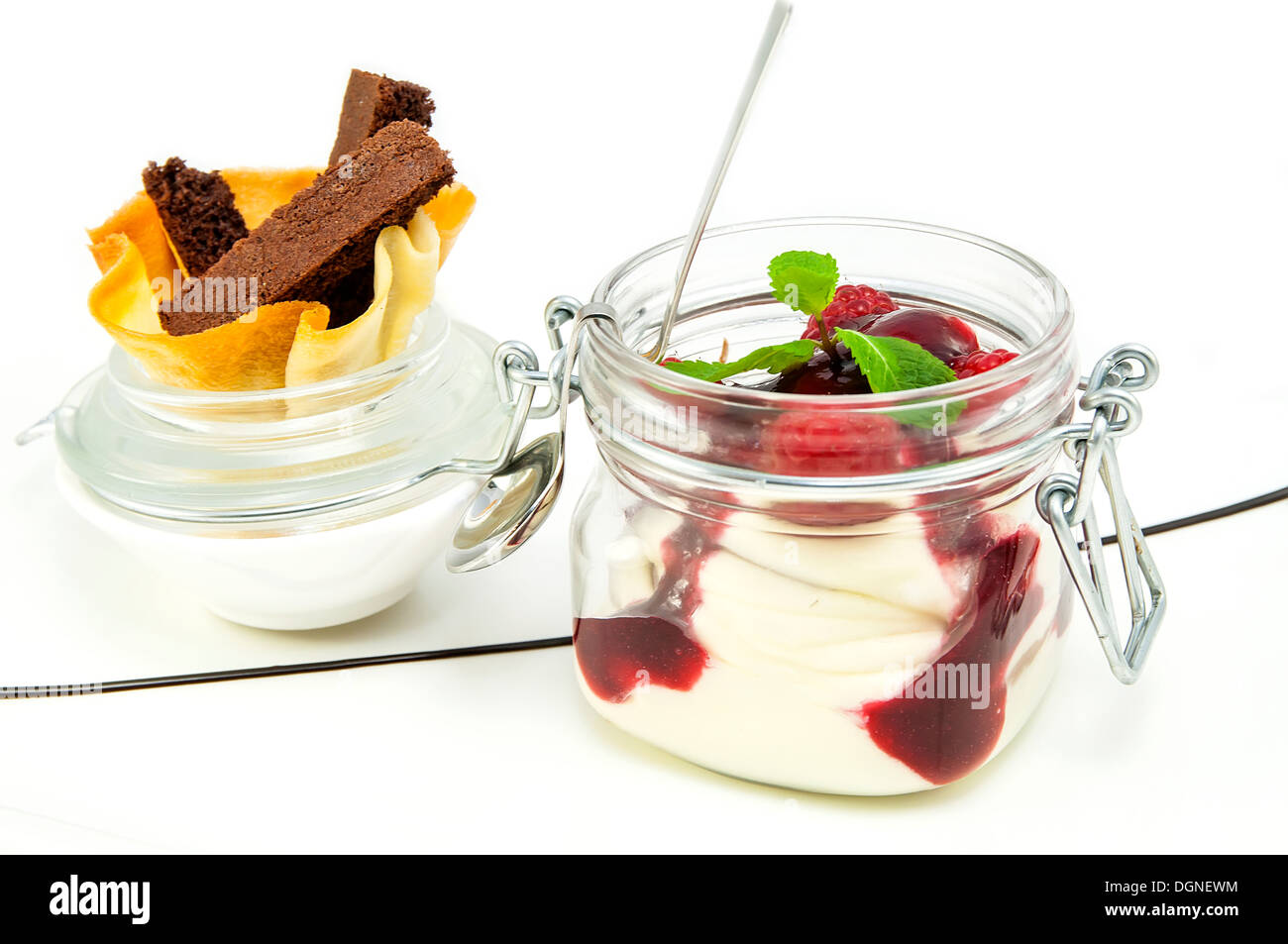 raspberry cream dessert in a glass jar Stock Photo - Alamy