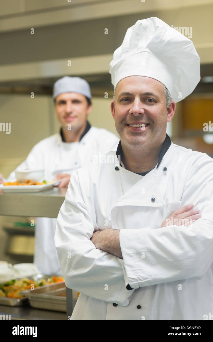 Happy mature head chef posing with crossed arms Stock Photo - Alamy