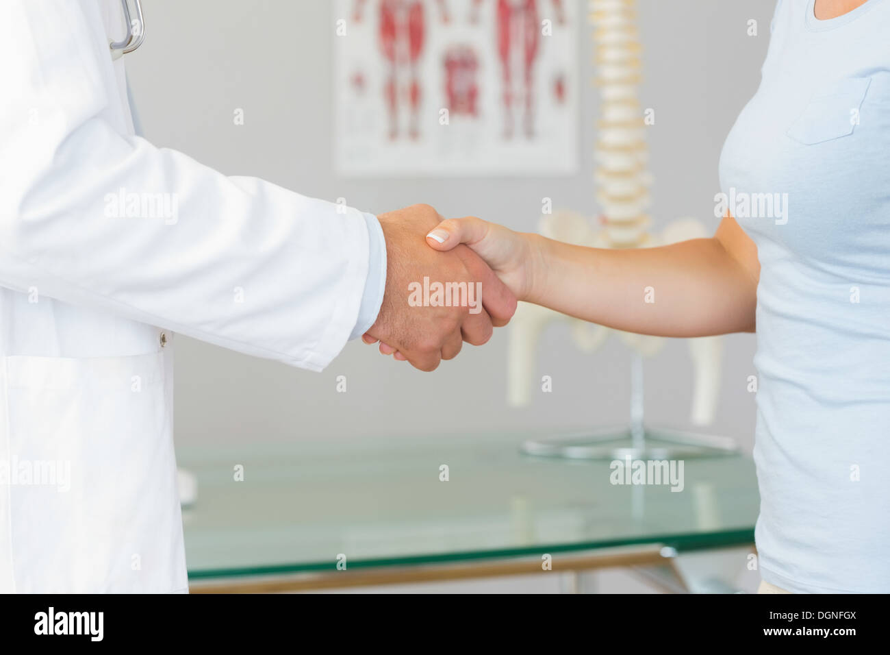 Close up of doctor shaking hands with patient Stock Photo - Alamy