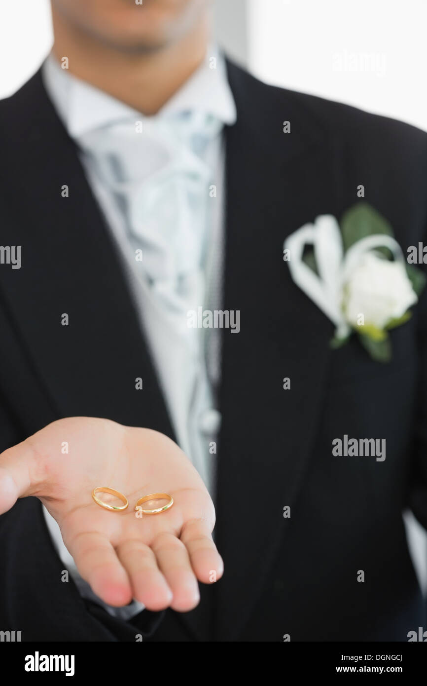 Young bridegroom showing wedding rings Stock Photo - Alamy