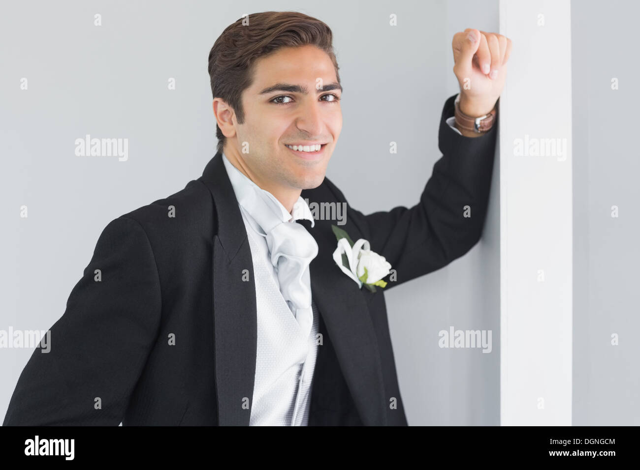 Leaning against wall man suit hi-res stock photography and images - Alamy