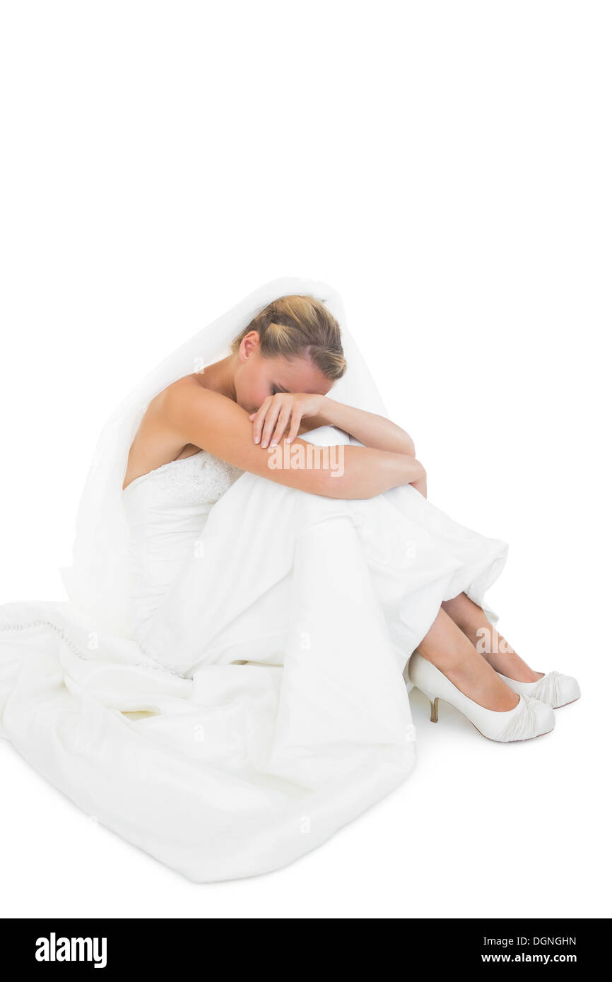 Sad blonde bride sitting on floor Stock Photo - Alamy