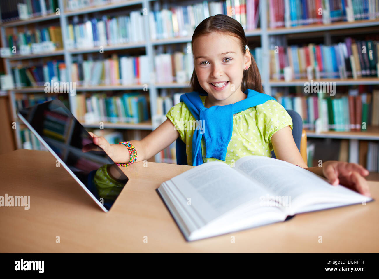Cheerful girl open book sitting hi-res stock photography and images - Alamy