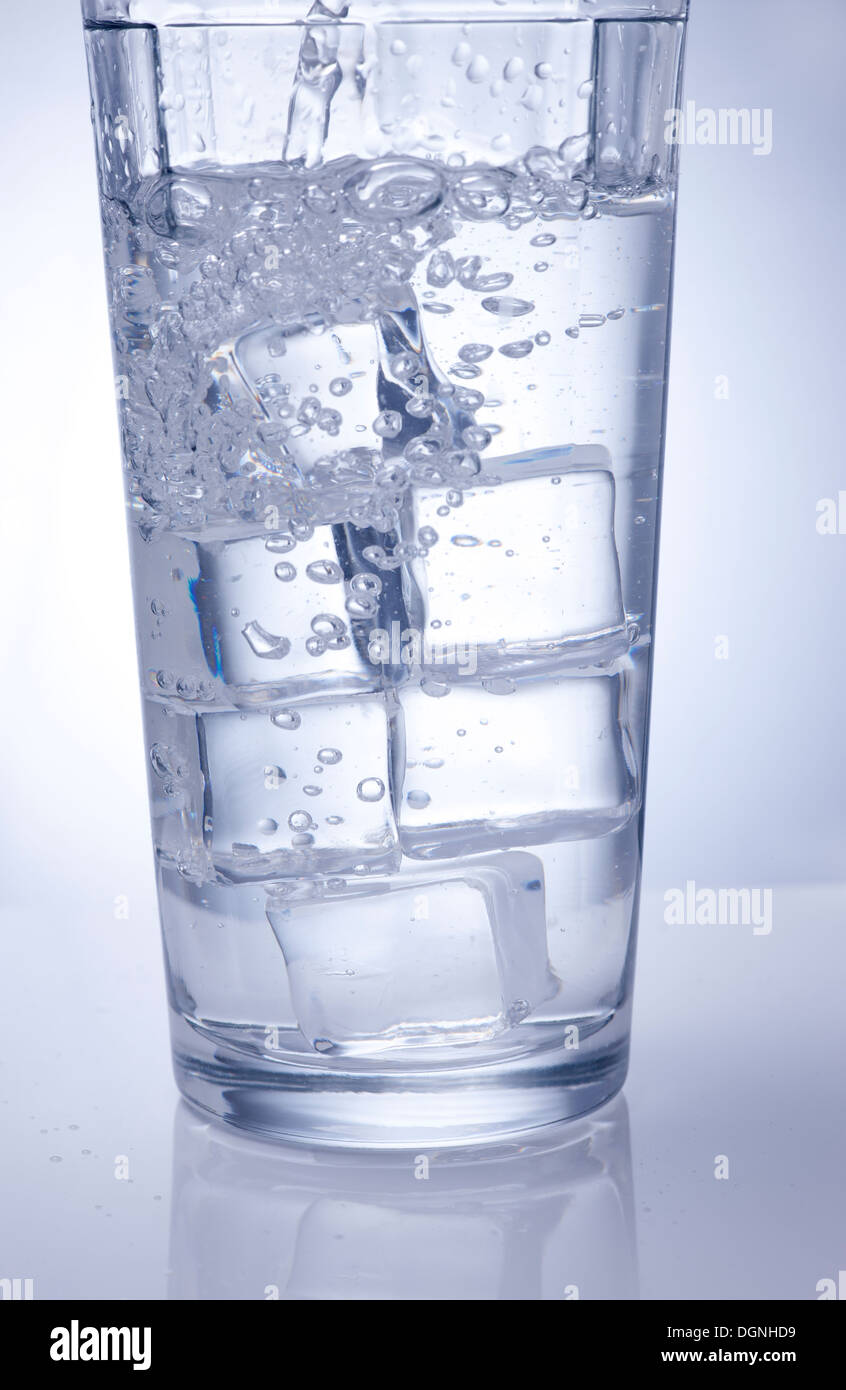 Glass of ice water with bubbles Stock Photo - Alamy