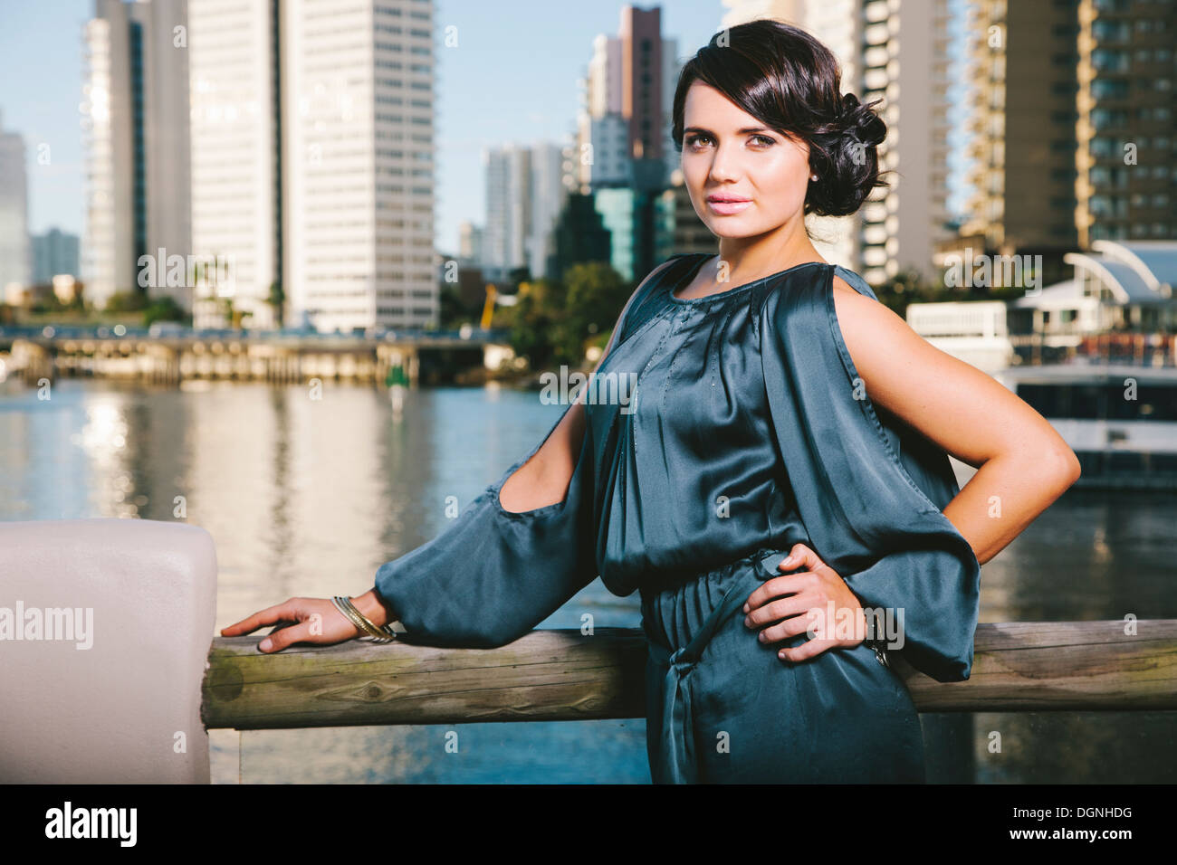 atractive young woman standing infront of river Stock Photo - Alamy