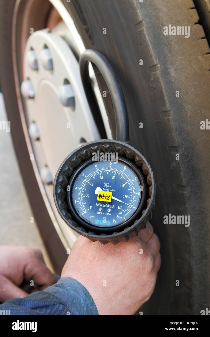 Tyre pressure measurement on a truck, Germany Stock Photo - Alamy