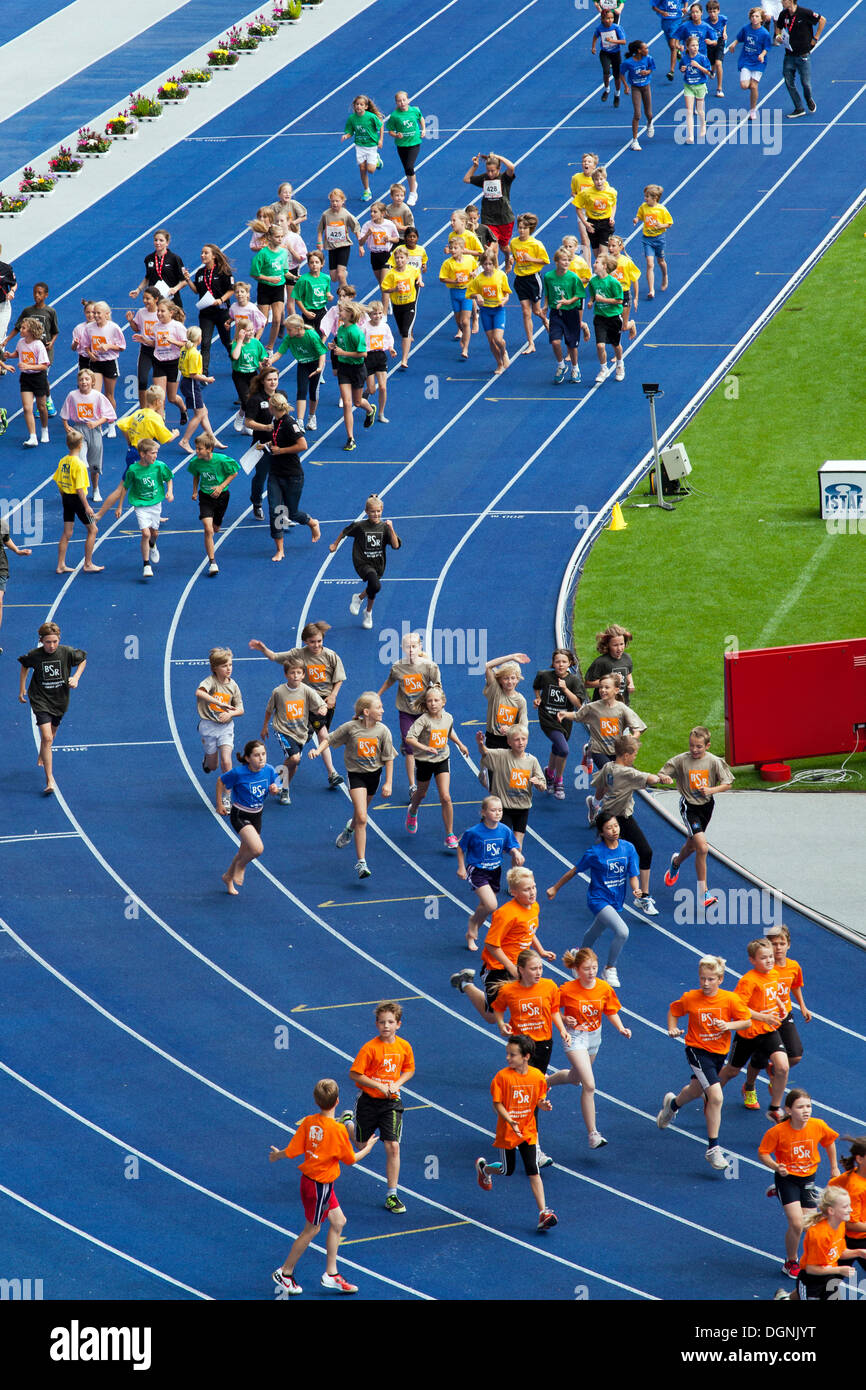 Athletic children of Berlin schools taking part in a running ...