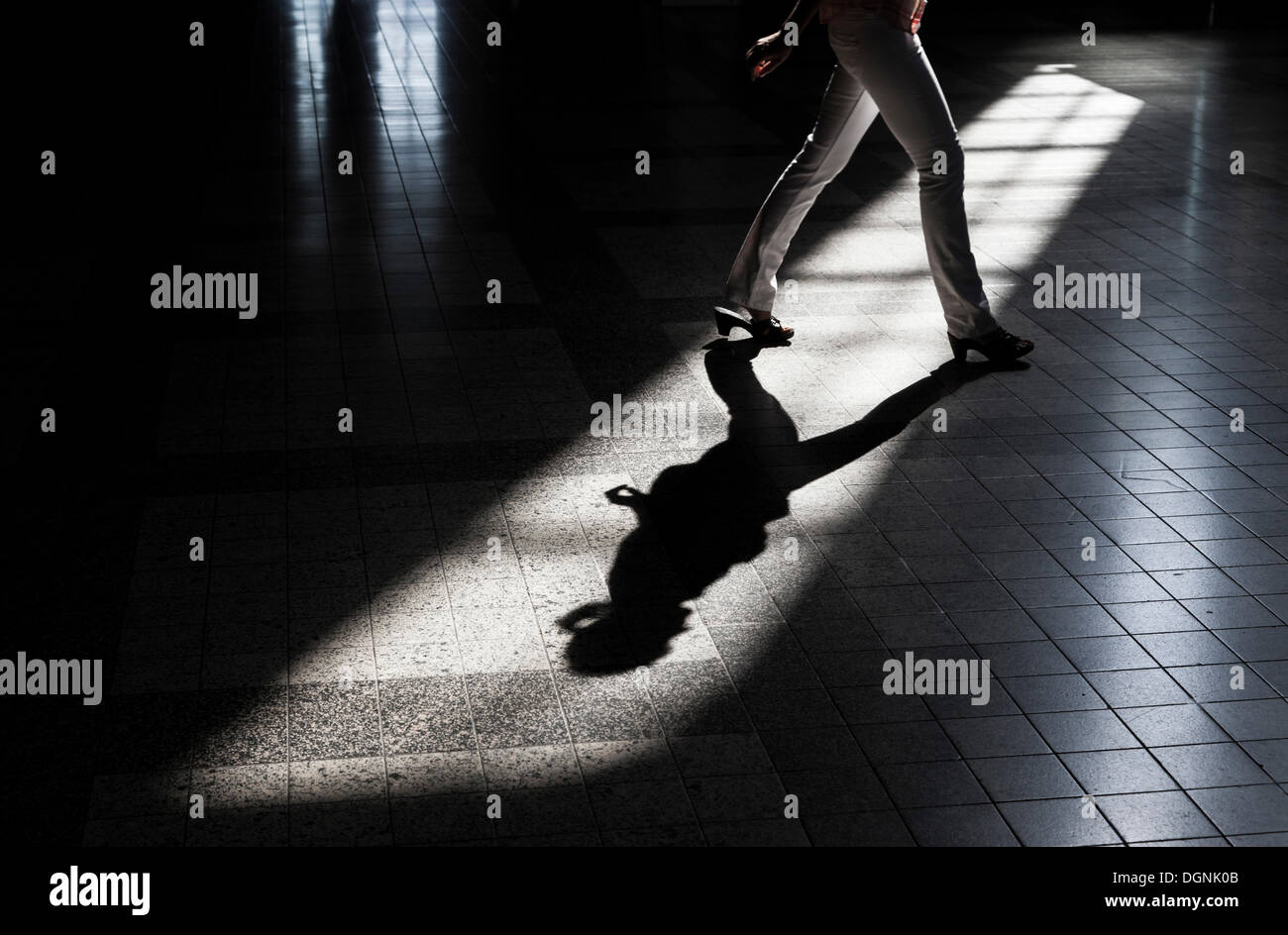 Woman walking inside building hi-res stock photography and images - Alamy