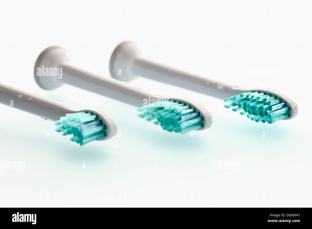 Three heads of toothbrushes, electric toothbrush Stock Photo - Alamy