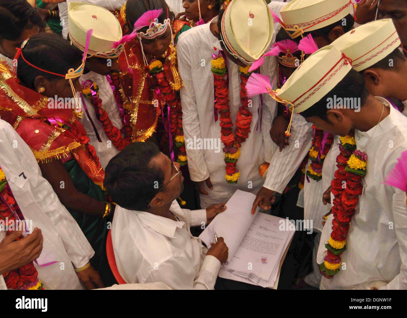 Couples gathered around the certifying officer for their marriage ...