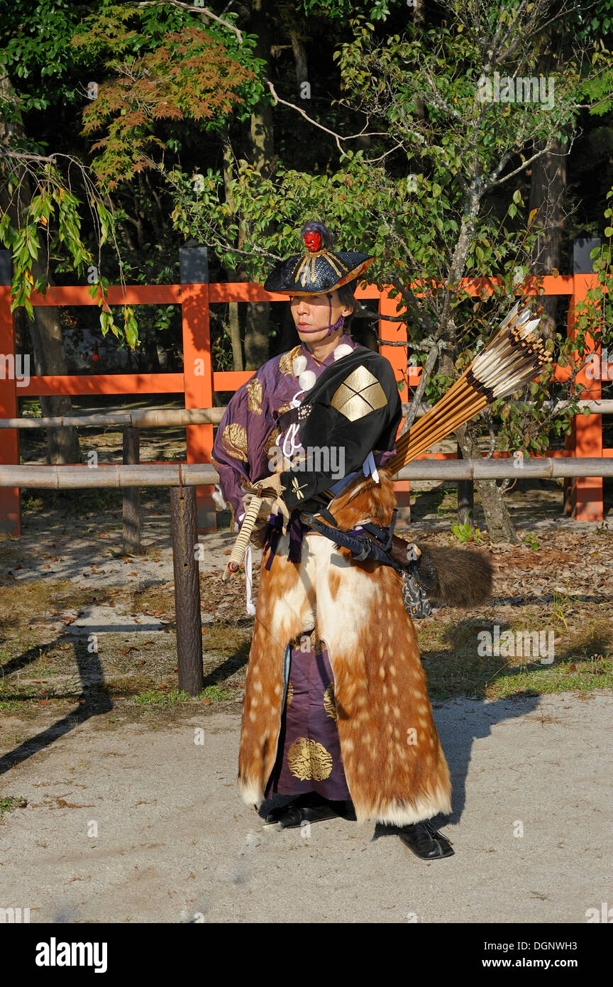Archer with bow and arrow, dressed in armour of the Heian period ...