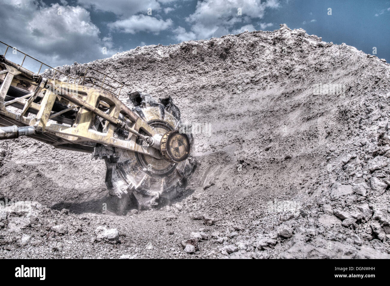 A construction vehicle loading clay onto a cargo truck Stock Photo - Alamy