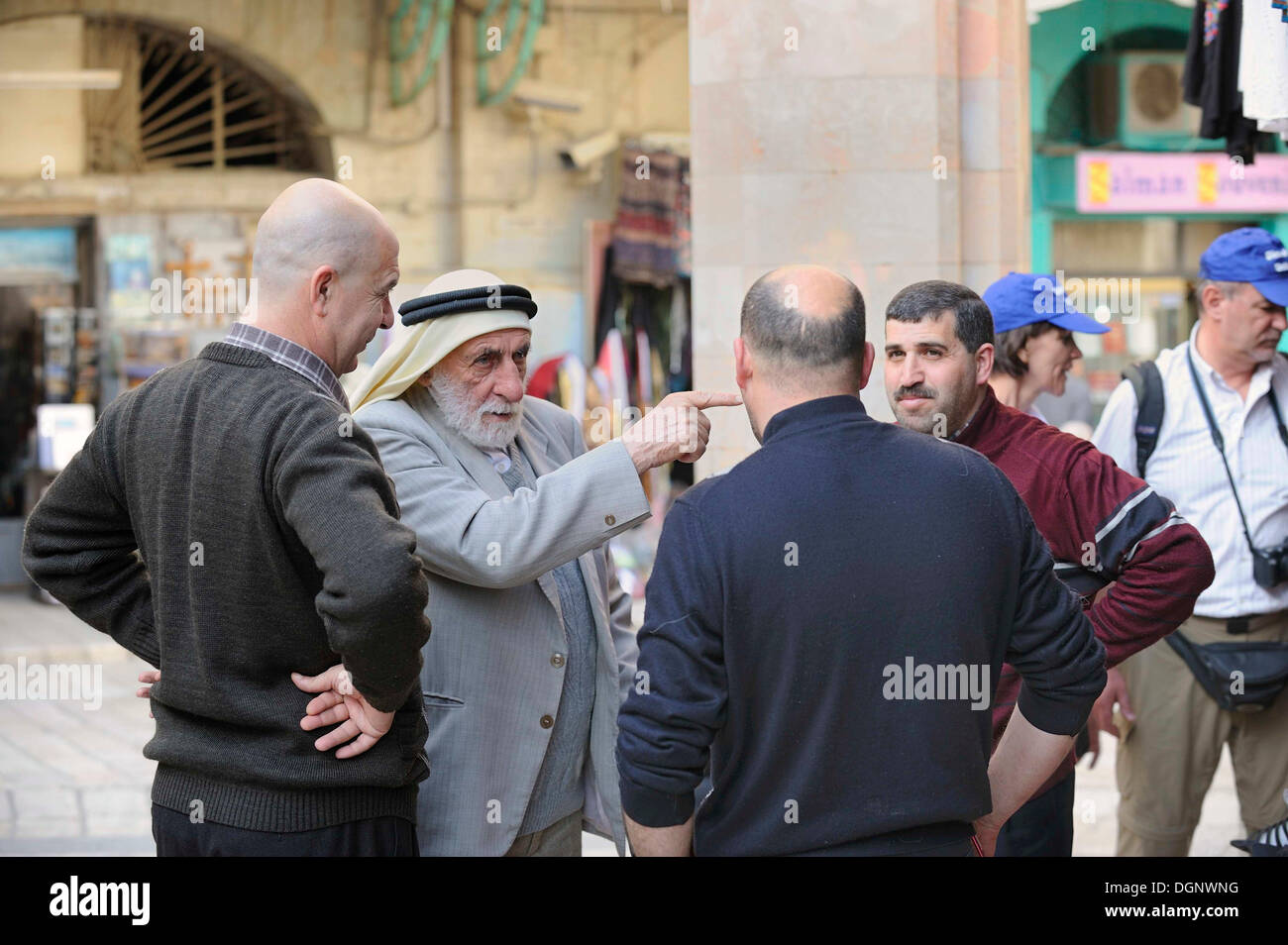 Palestinian men in conversation at the Muristan, Christian Quarter ...