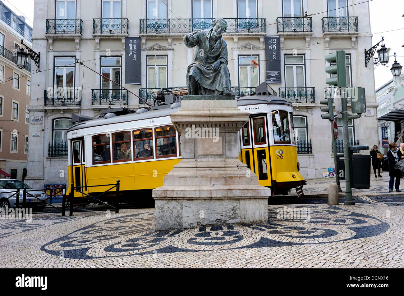 Tram on Largo do Chiado square, statue of the poet António Ribeiro in ...