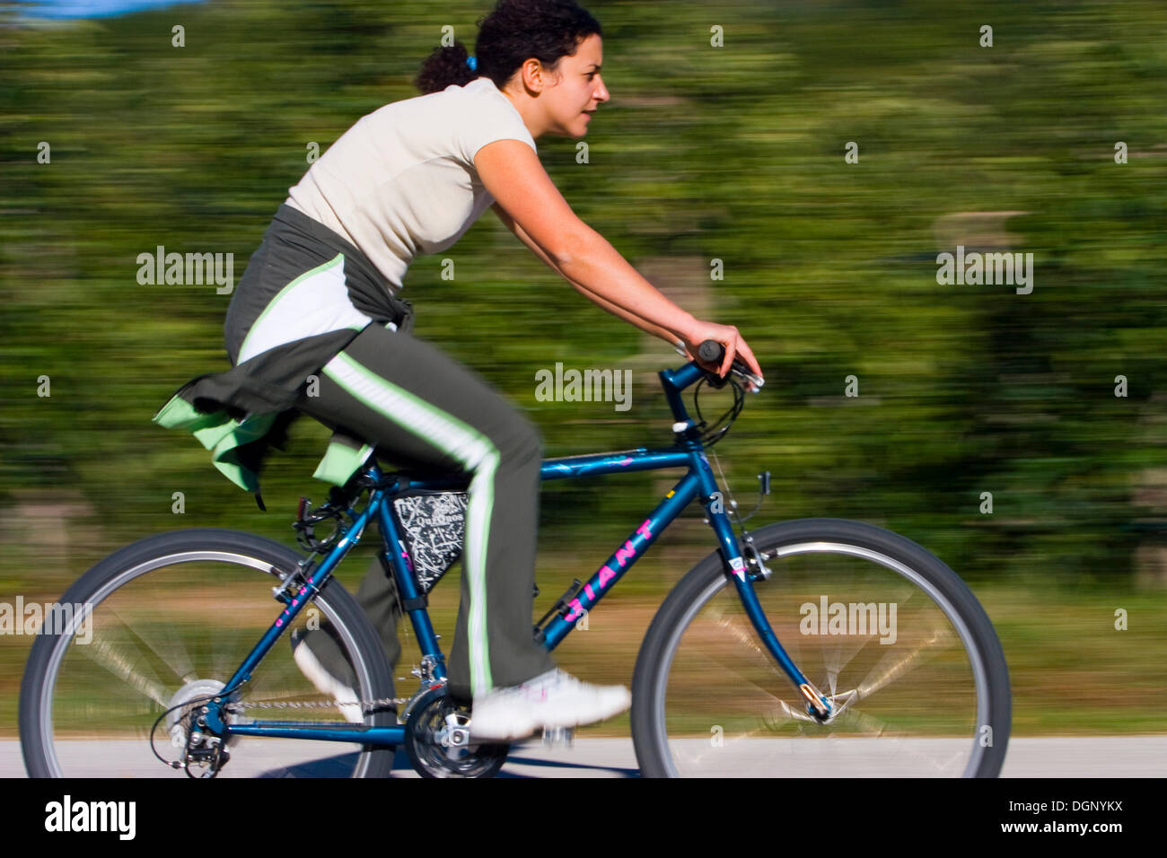 Cyclist, woman riding a bike Stock Photo - Alamy