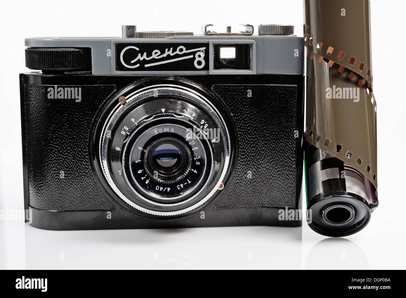 Lens of a 35-mm camera. Analogue apparatus and the negative of the film ...