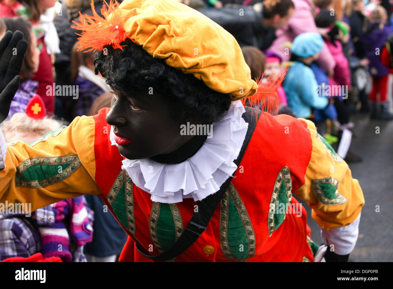 Dutch Black Piet in close up handing out presents Stock Photo - Alamy