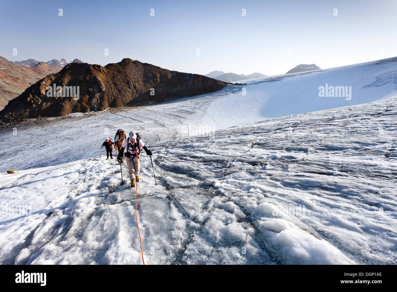 Hikers during the ascent to the peak of Similaun mountain, on ...