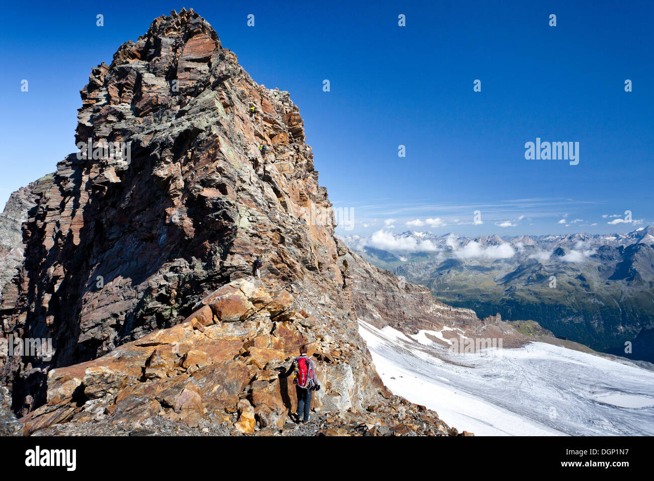 Hiker climbing Schneebiger Nock mountain, province of Bolzano-Bozen ...