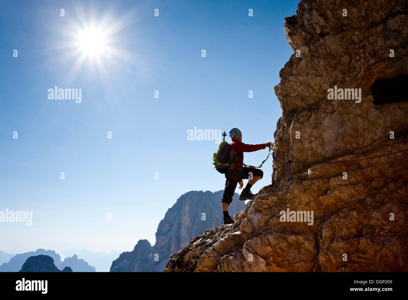 Mountain climber climbing the Marino Bianchi climbing route on Monte ...