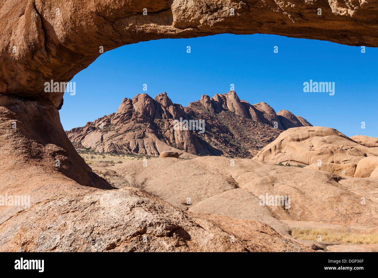 Rock arch, Pontok Mountains at the back, near the Spitzkoppe granite ...