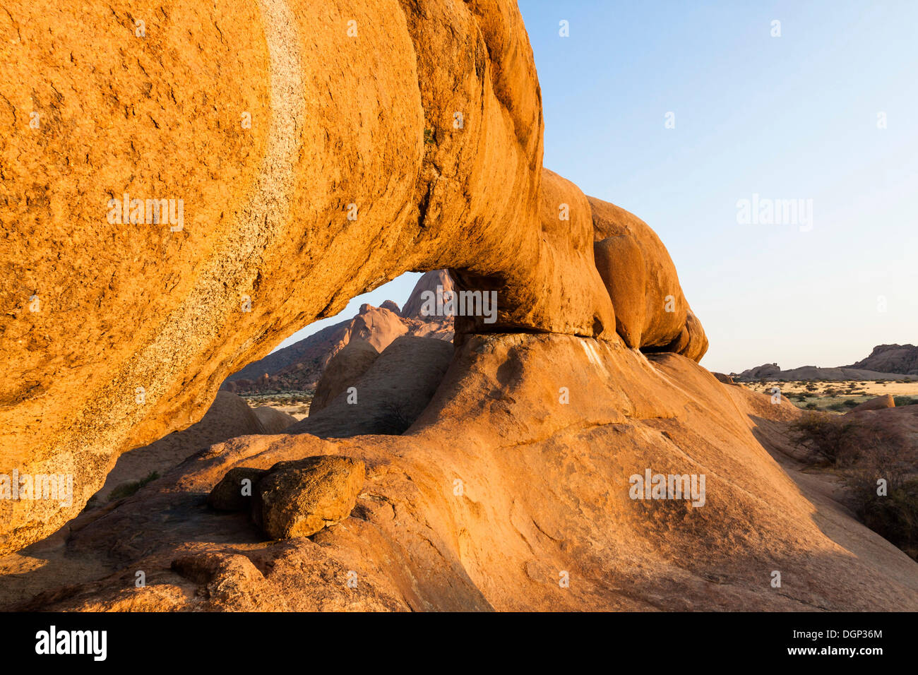 Rock arch, Spitzkoppe granite peaks at the back, Damaraland, Namibia ...