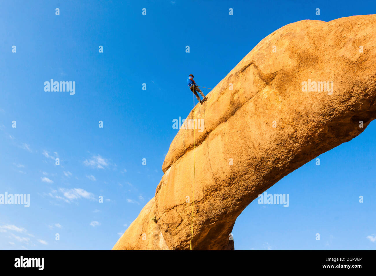 Young man climbing abseiling hi-res stock photography and images - Alamy
