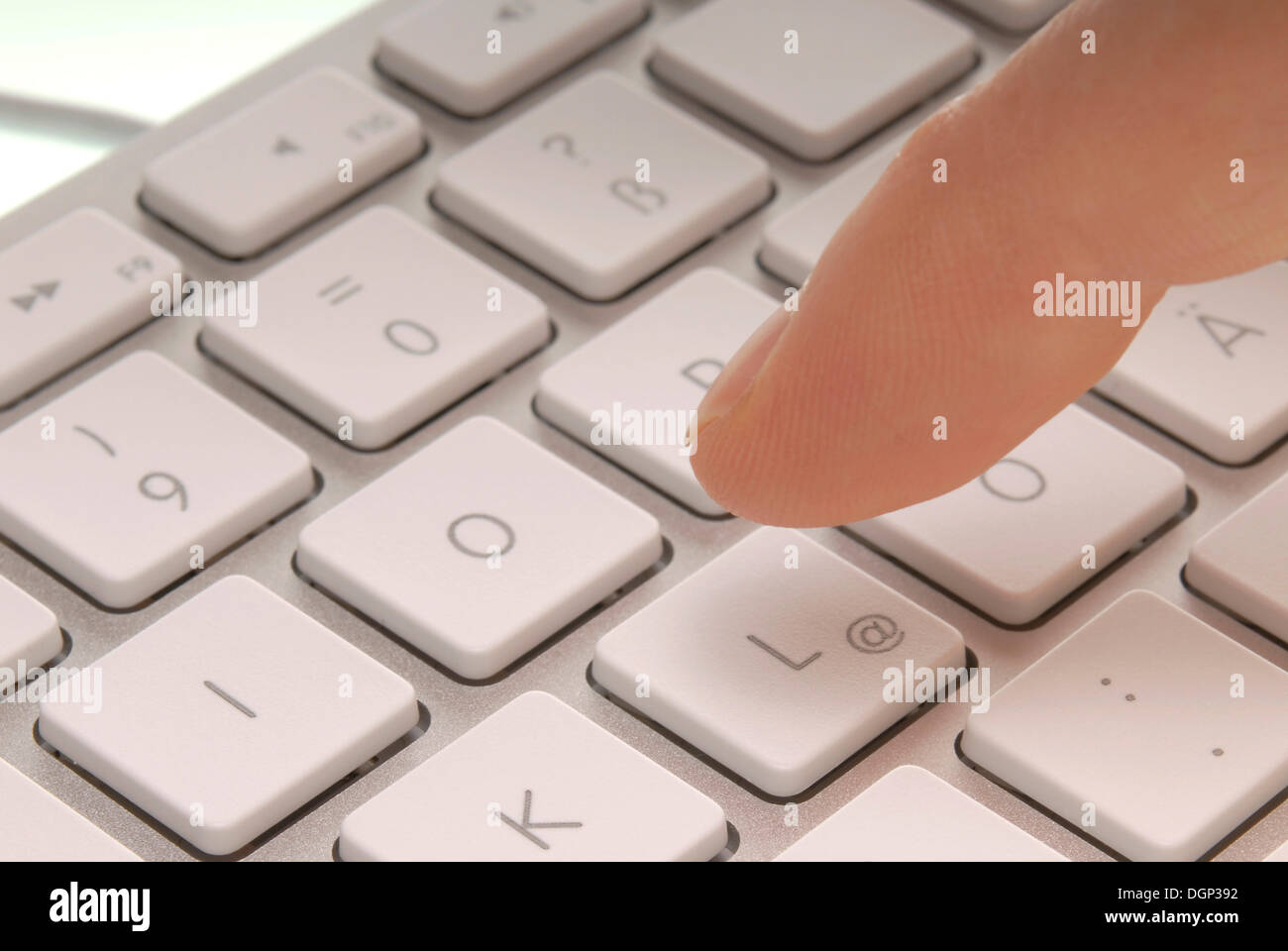 Female hand pressing the at-key Stock Photo - Alamy Female hand pressing the at-key Stock Photo - Alamy