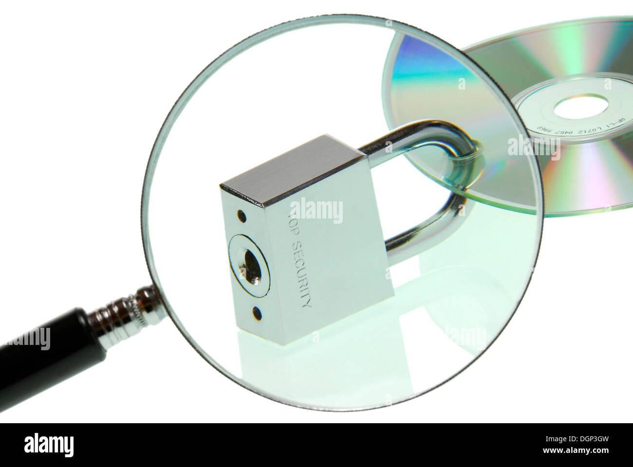 Magnifying glass showing padlock on data-CD, symbolic image for data ...