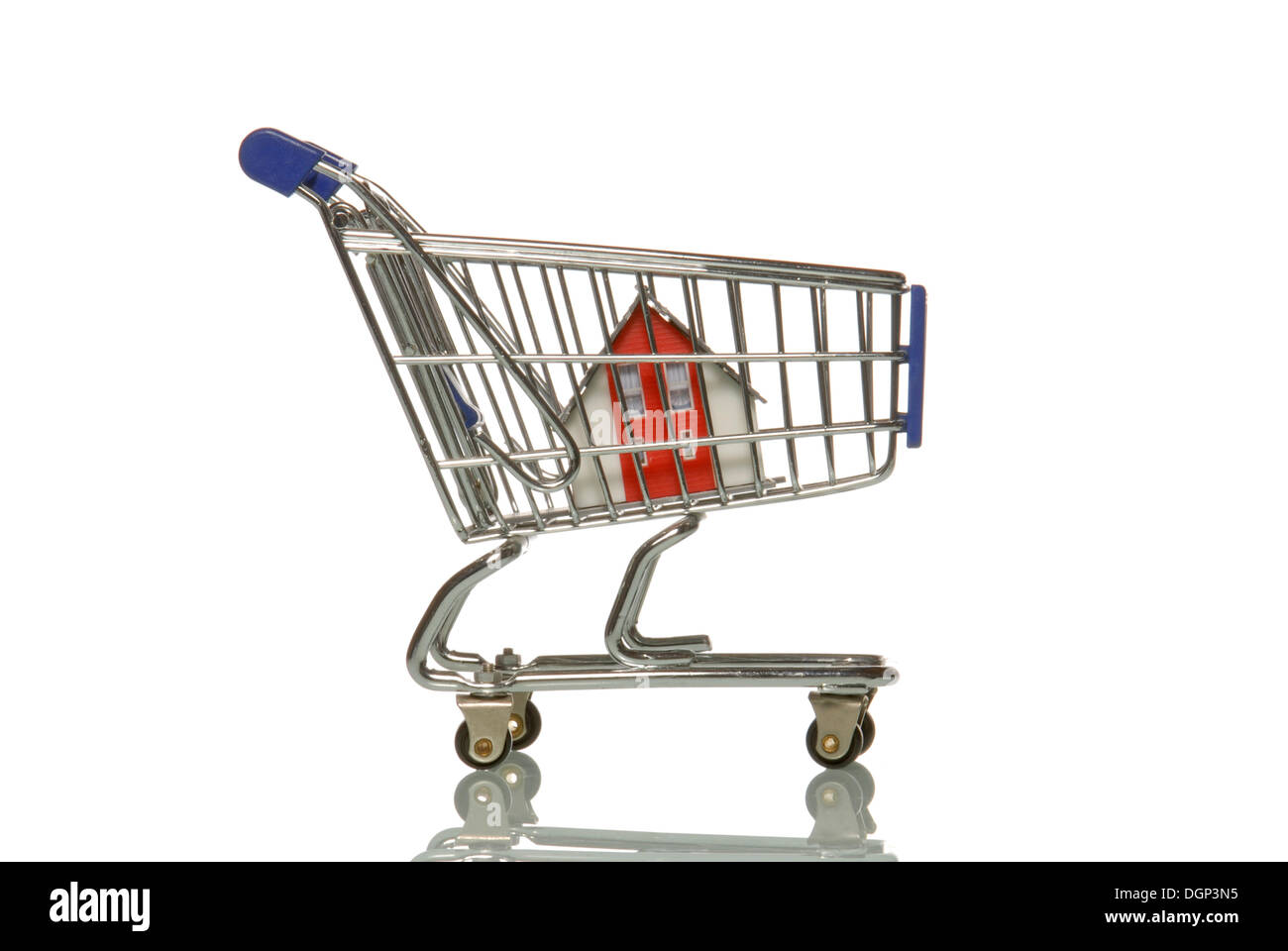 Small house in a shopping cart, symbolic image for property purchases ...