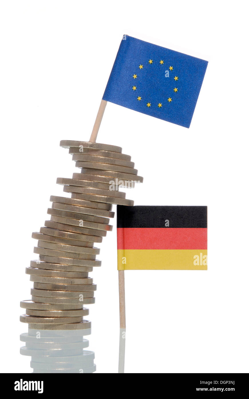 Wobbly stack of Euro coins supported by a German flag, a Euro flag on ...