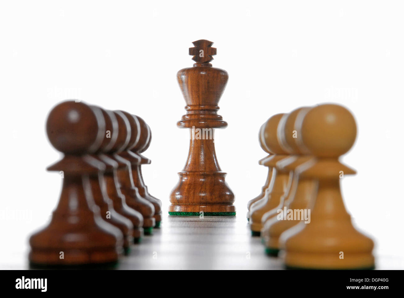 Two rows of chess pawns with the King in the middle Stock Photo - Alamy