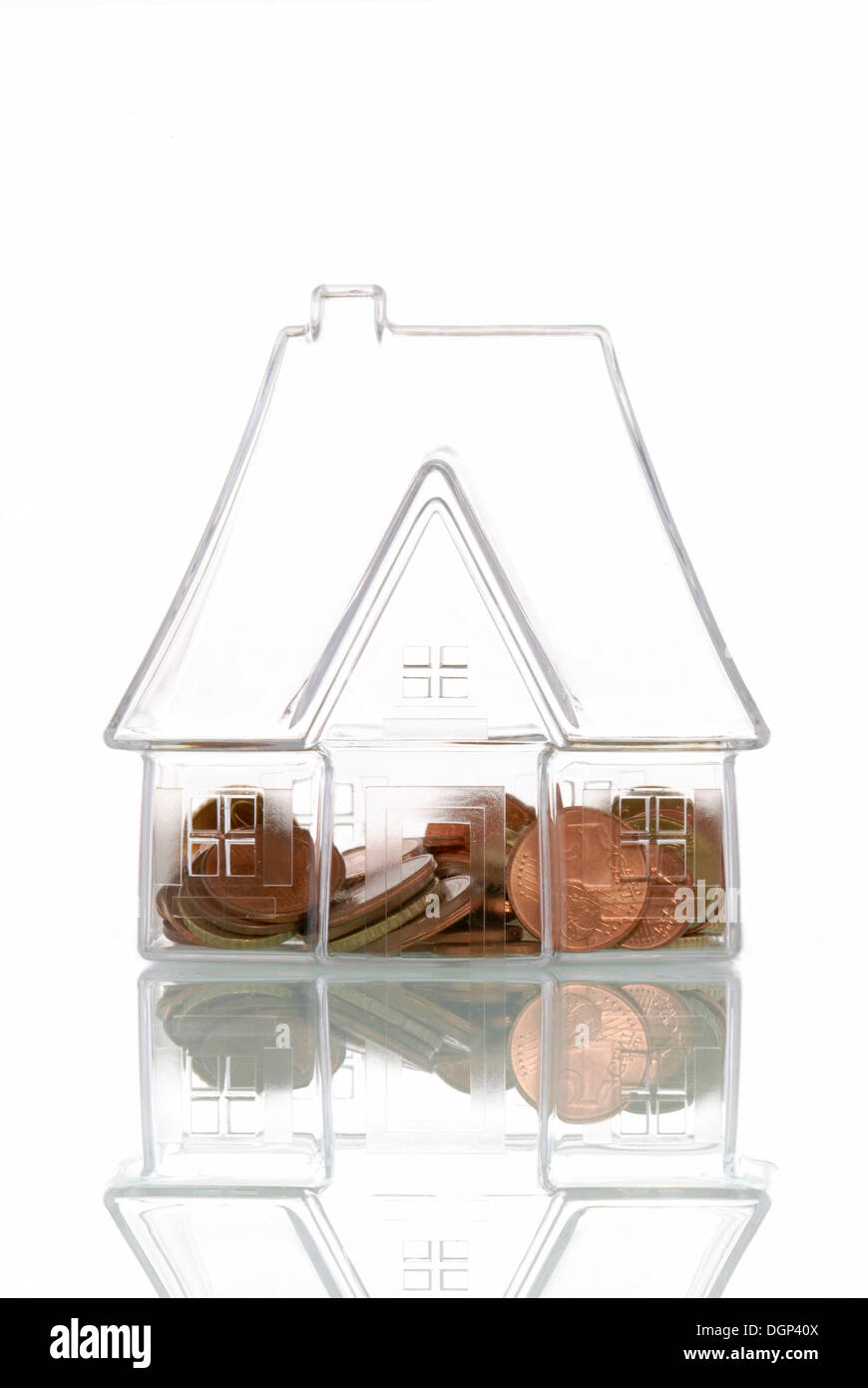 Transparent house with coins, symbolic image for transparency in the ...