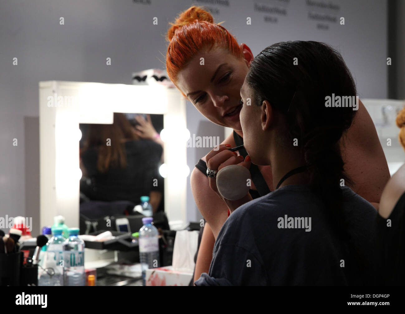 Berlin, Germany, makeup is applied in the models at Fashion Week Stock ...
