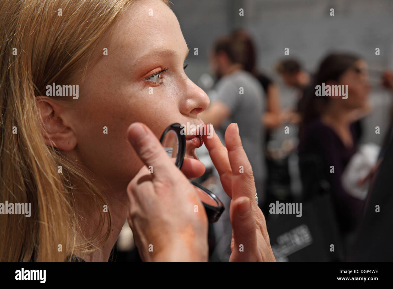 Berlin, Germany, makeup is applied in the models at Fashion Week Stock ...